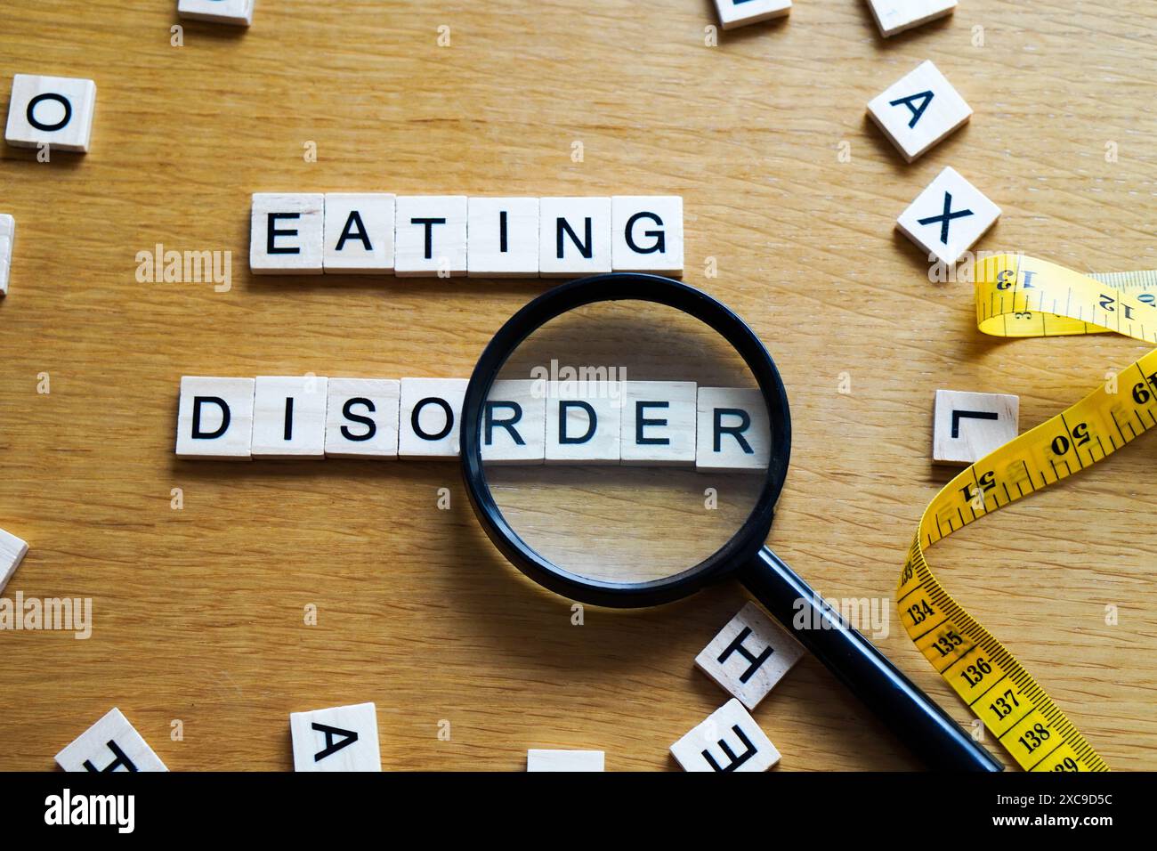 magnifying glass on the words EATING DISORDER and measuring tape Stock ...