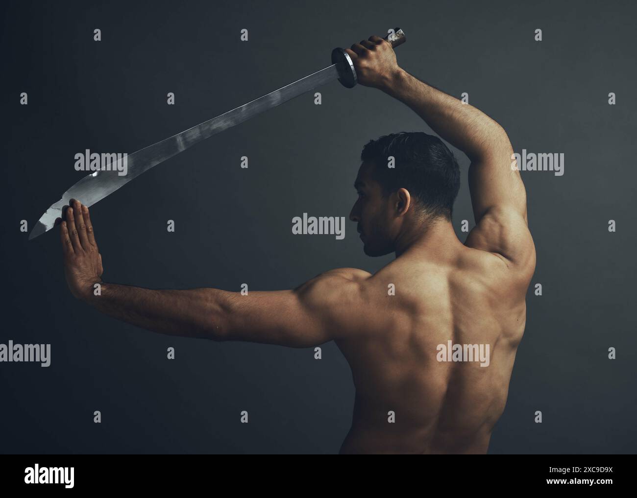 Man, back and samurai sword in studio for training, exercise and ...