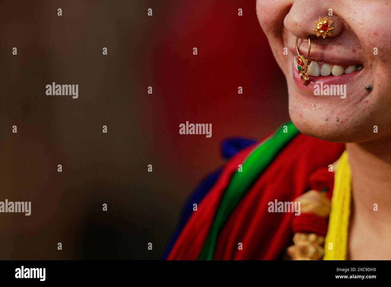 Kathmandu, Nepal. 15th June, 2024. A woman with jewelry on her face ...