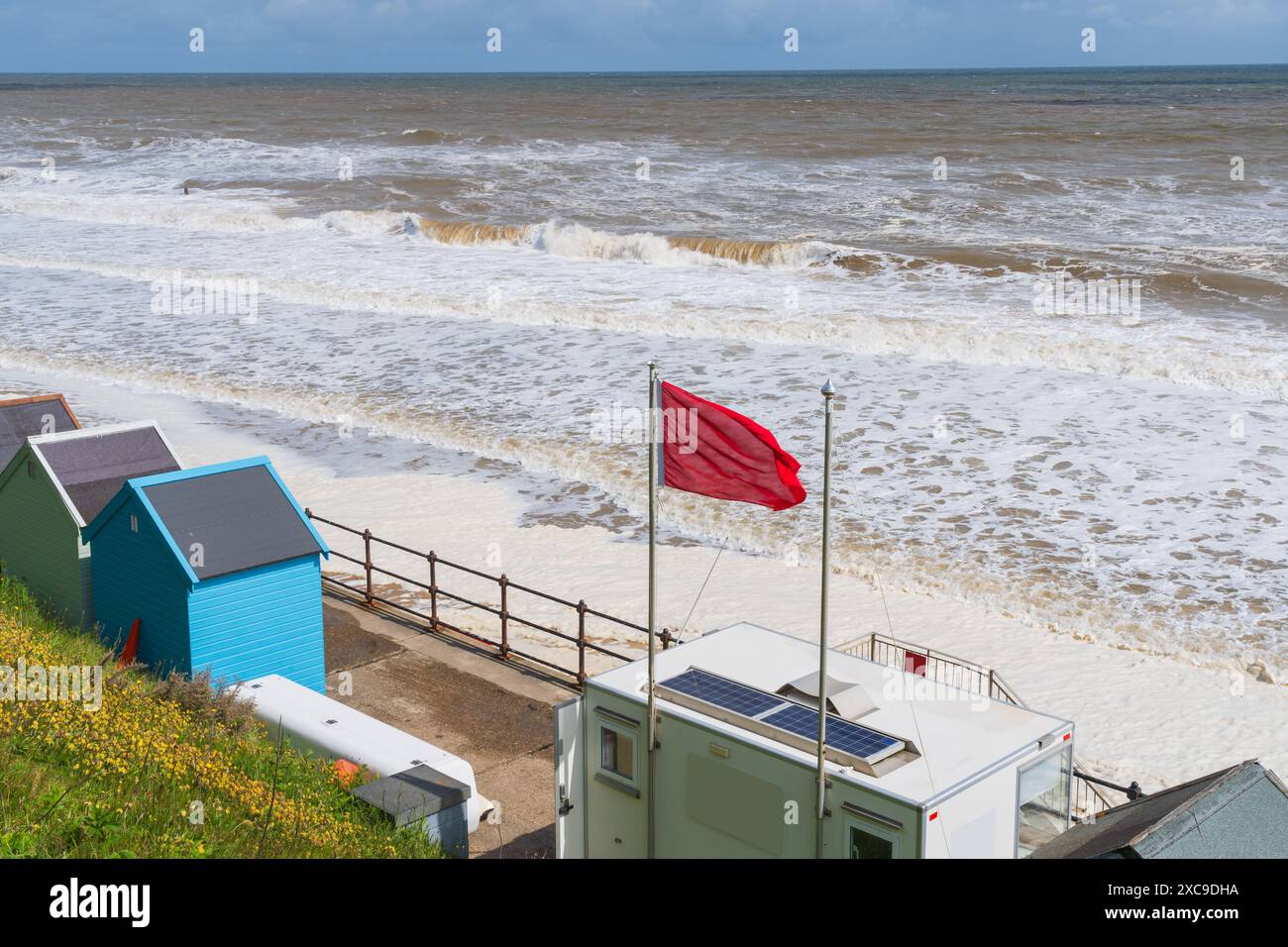 Red flag on the beach in Mundesley, North Norfolk, UK indicating rough ...