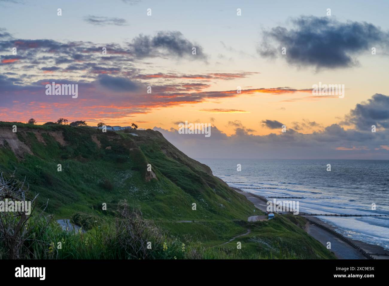 Trimingham beach sunset colours at dusk in landscape orientation Stock ...