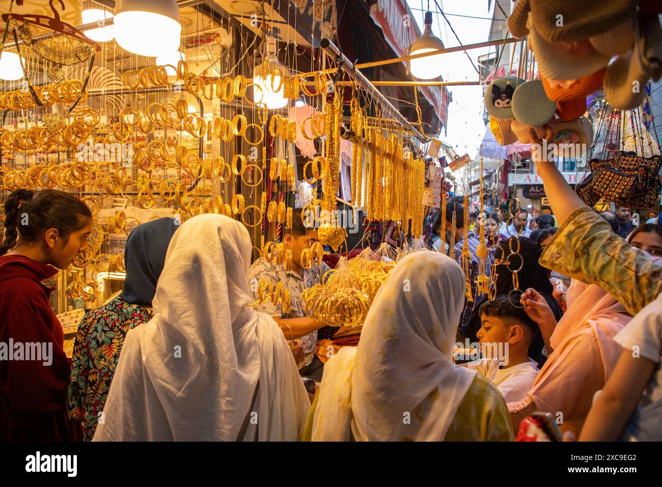 Srinagar, India. 15th June, 2024. Kashmiri people shop ahead of the Muslim festival Eid al-Adha ...