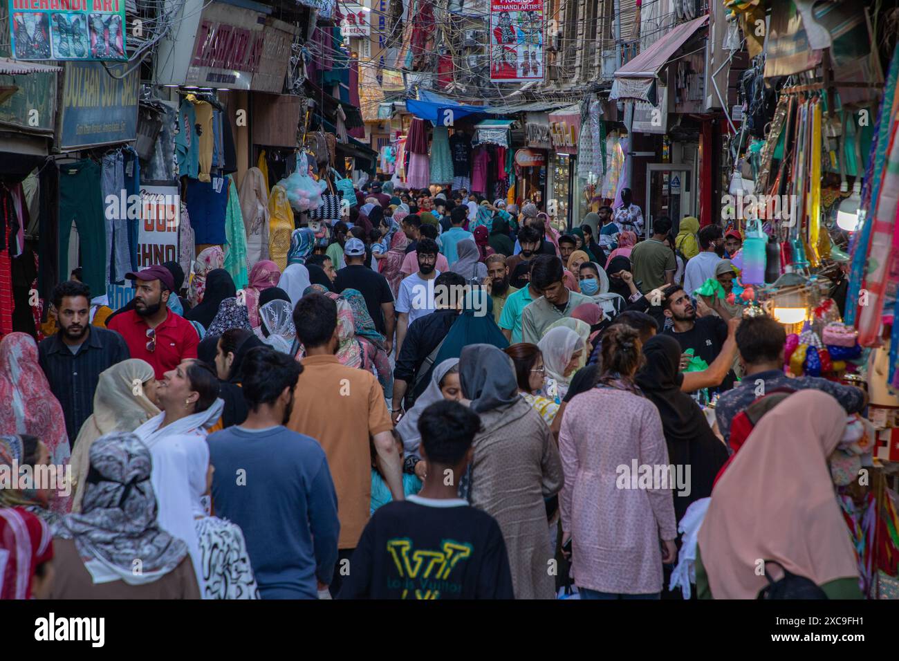 Srinagar, India. 15th June, 2024. Kashmiri people shop ahead of the Muslim festival Eid al-Adha ...