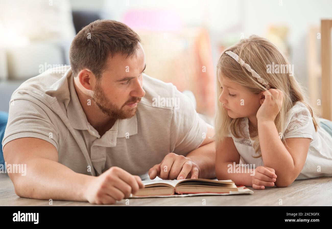 Reading, book and father with kid on floor for relaxing, bonding and ...