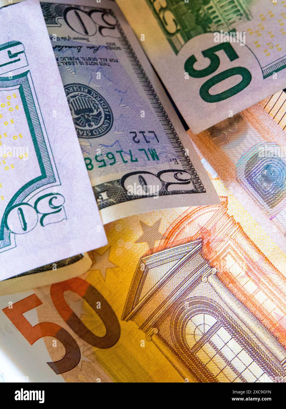 Euro and Dollar Bills. A 50 Euro note and a 50 Dollar bill, both ...