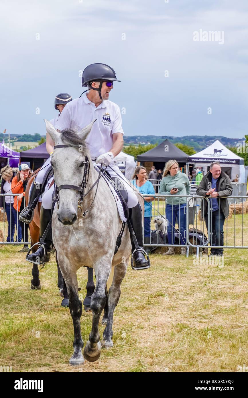 Powderham, UK. 15th June, 2024. Dog lovers descend on Powderham Castle ...