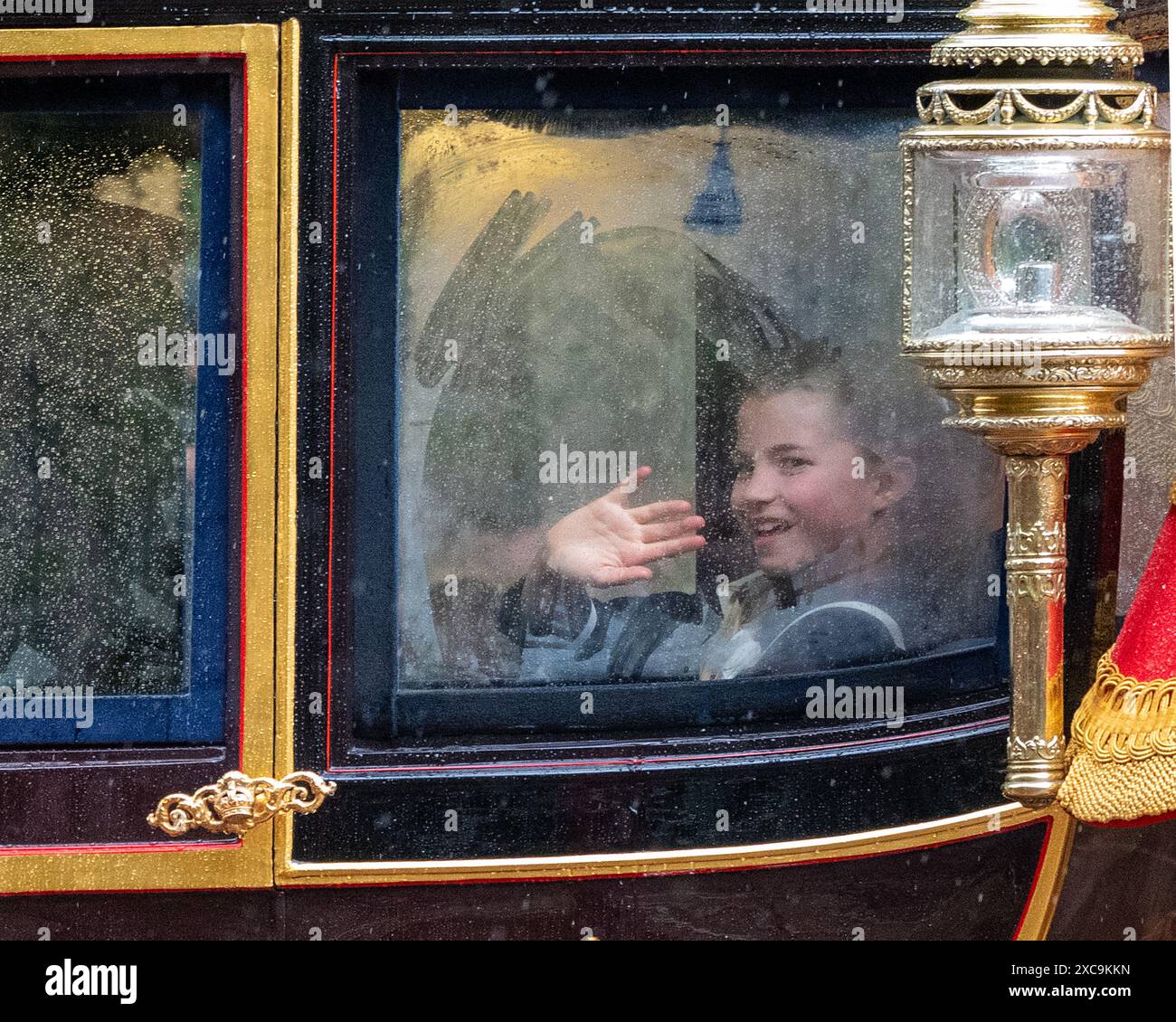 London, UK 15th Jun 2024. Princess Charlotte waves to crowds through a ...