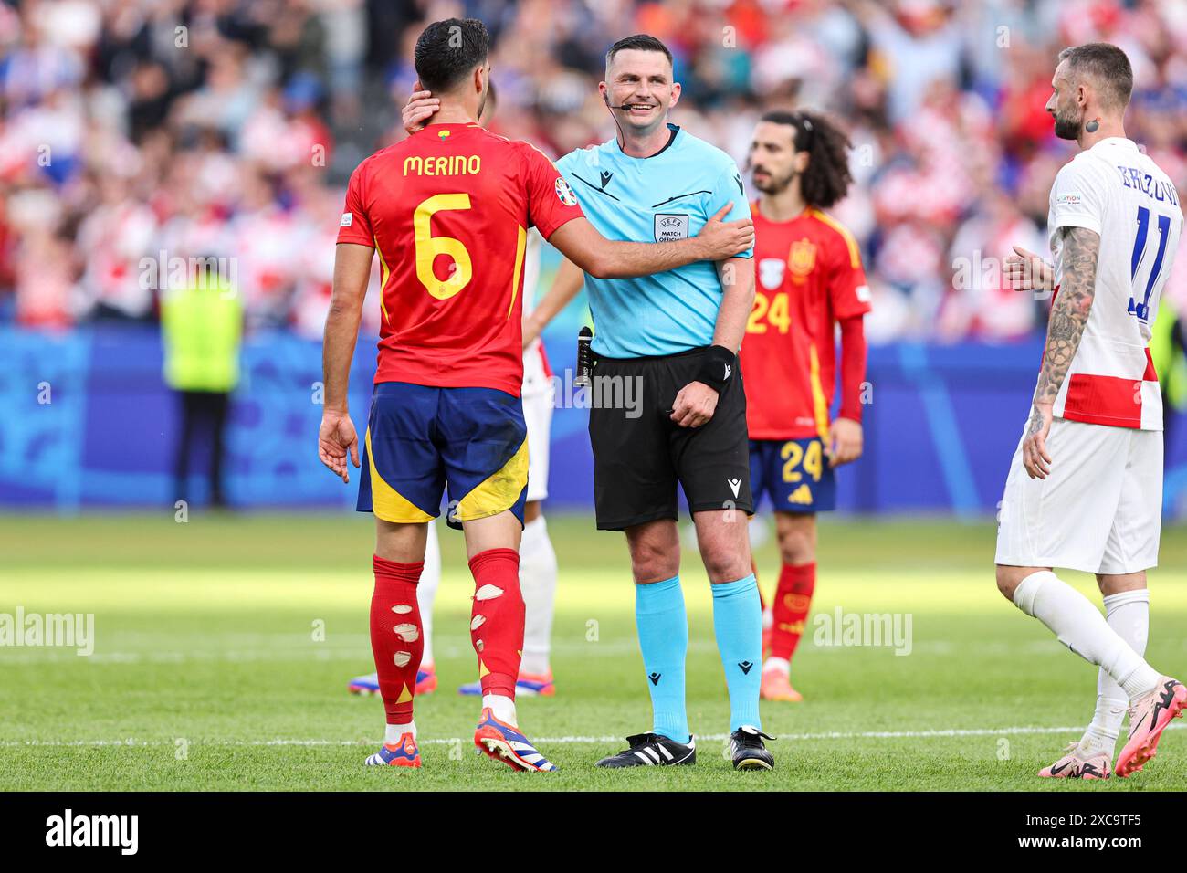 BERLIN, GERMANY - JUNE 15: Mikel Merino of Spain, referee Michael ...