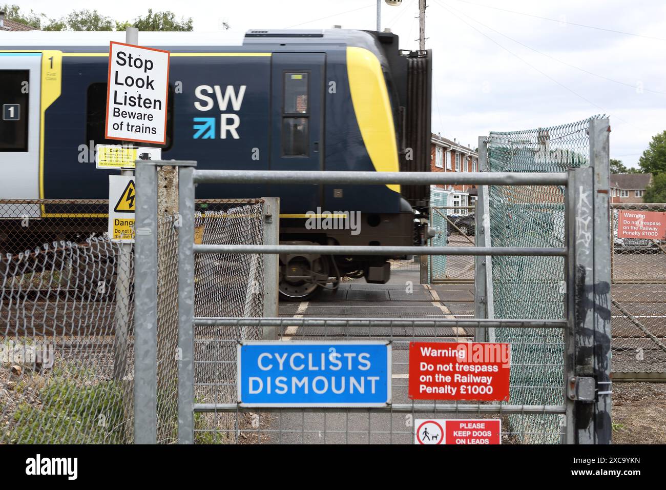 Railway foot crossing Frimley Green Hampshire UK with warning signs ...