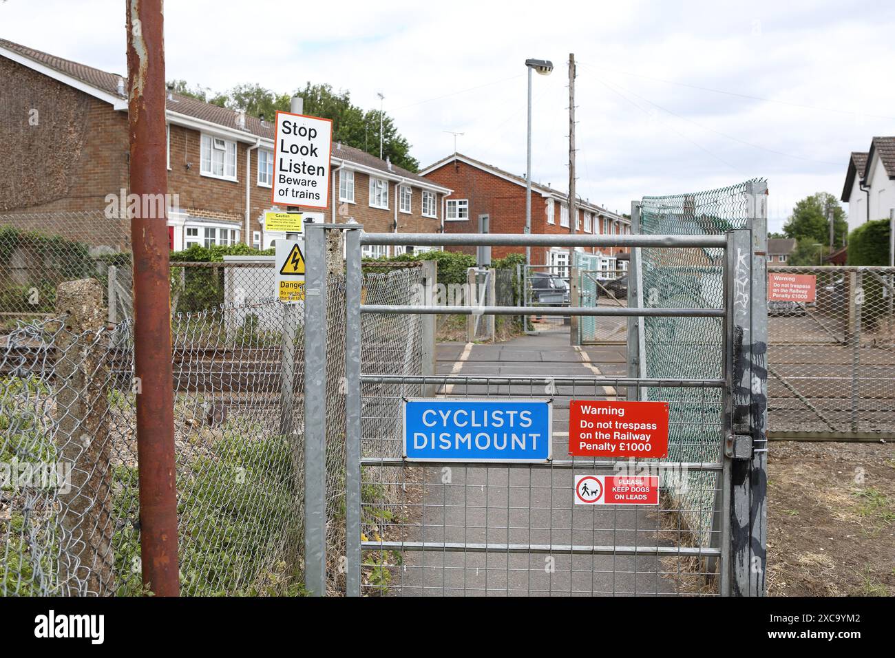 Railway foot crossing Frimley Green Hampshire UK with warning signs ...