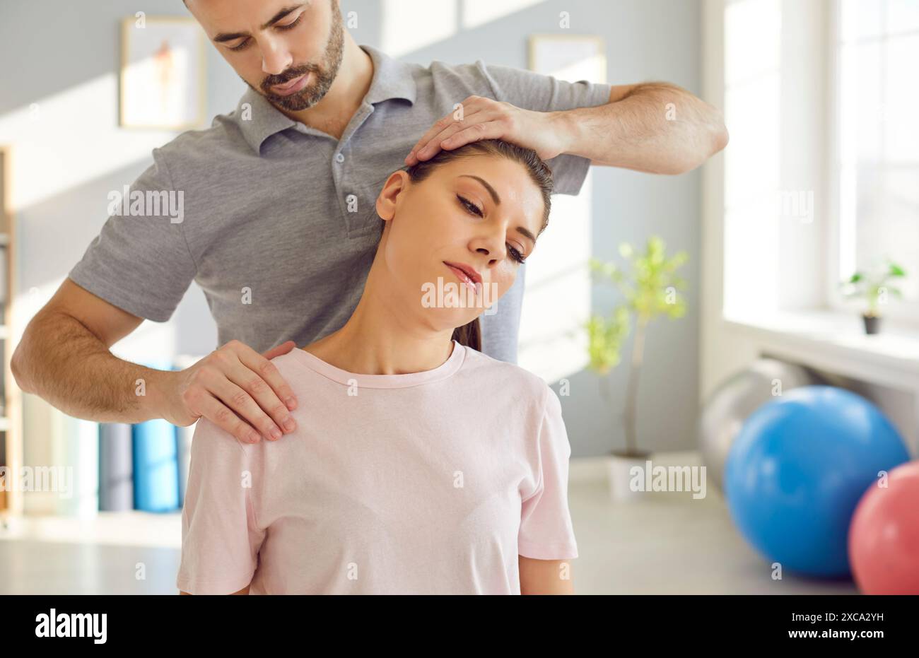 Man masseur performing neck hi-res stock photography and images - Alamy