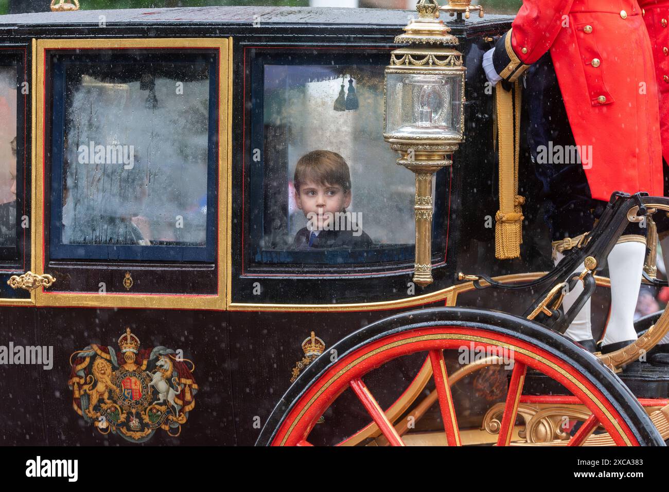 Prince Louis of Wales peering out from a condensation windowed Royal ...
