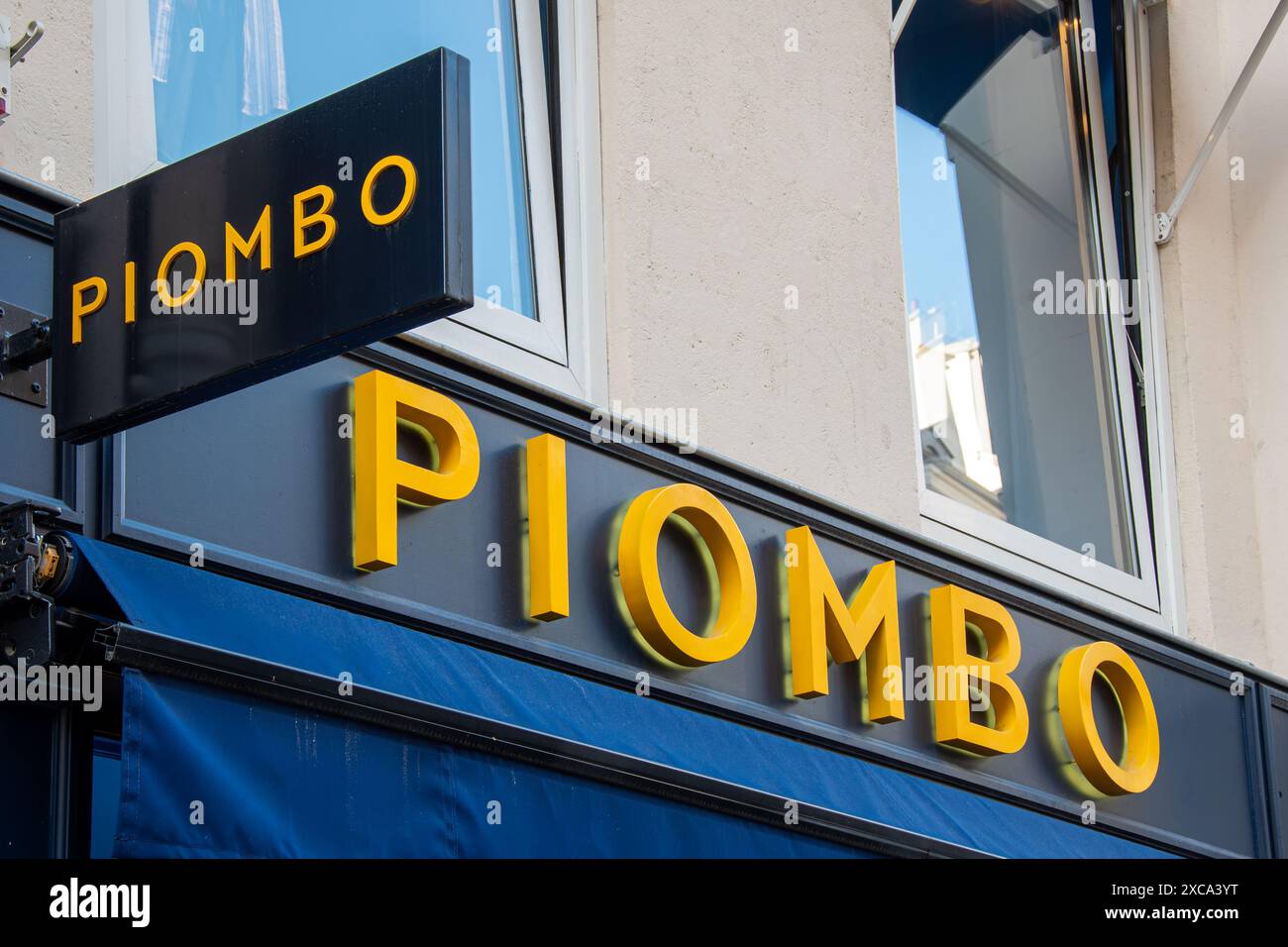 Sign and logo of a Piombo store in Paris, France. Piombo is a ready-to ...