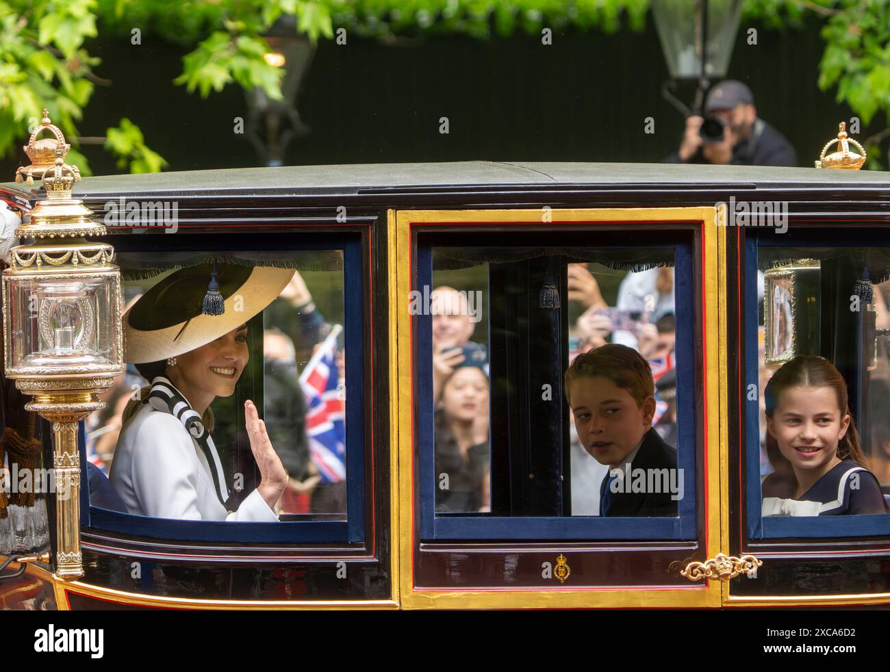 © Jeff Moore The Princess of Wales waves as she travels in a carriage ...