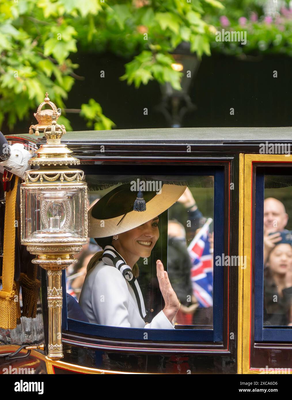 © Jeff Moore The Princess of Wales waves as she travels in a carriage ...
