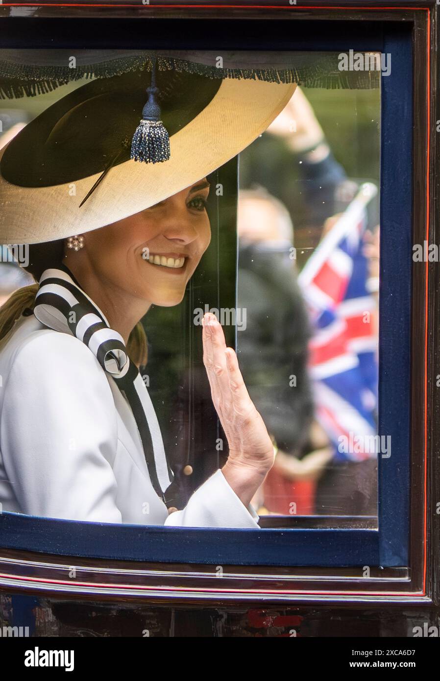 © Jeff Moore The Princess of Wales waves as she travels in a carriage ...