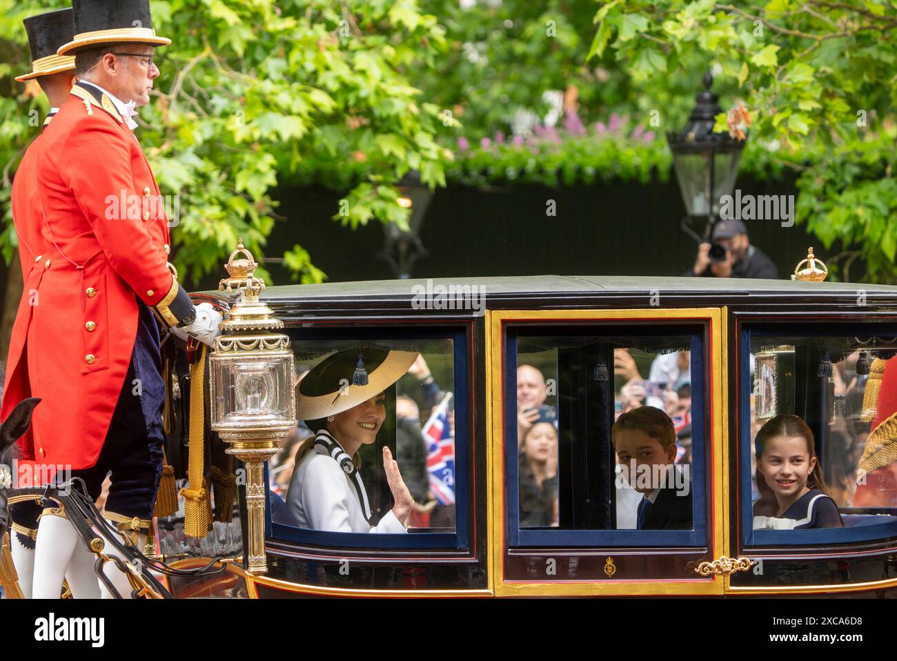 © Jeff Moore The Princess of Wales waves as she travels in a carriage ...