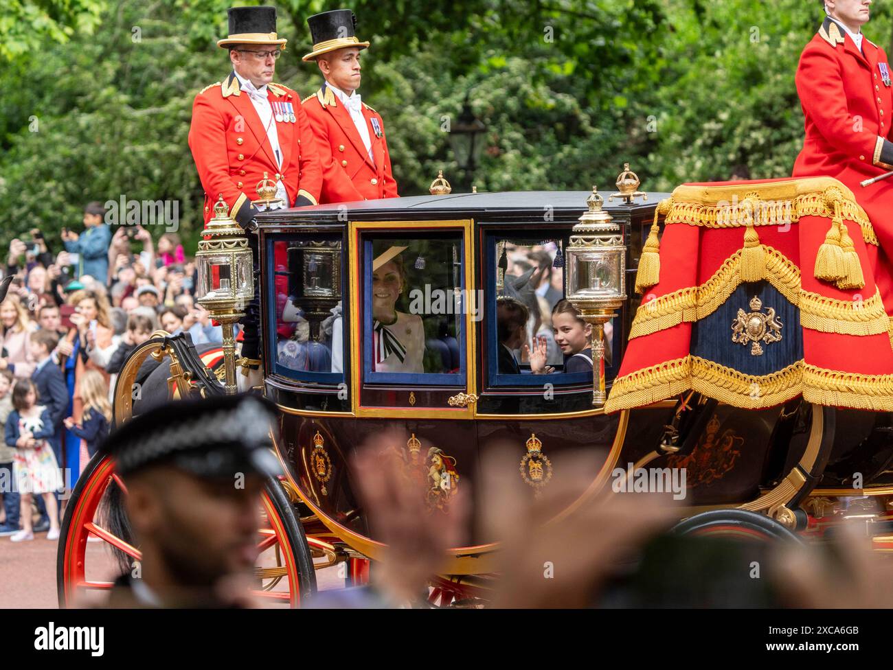 © Jeff Moore The Princess of Wales waves as she travels in a carriage ...