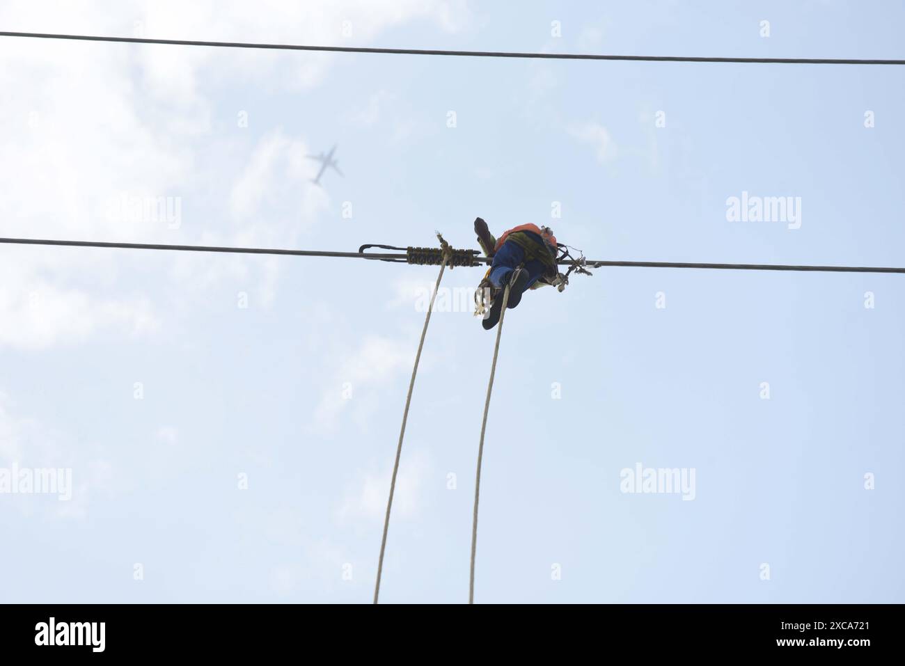 GURUGRAM, INDIA - JUNE 15: Workers are seen changing the wires on a ...