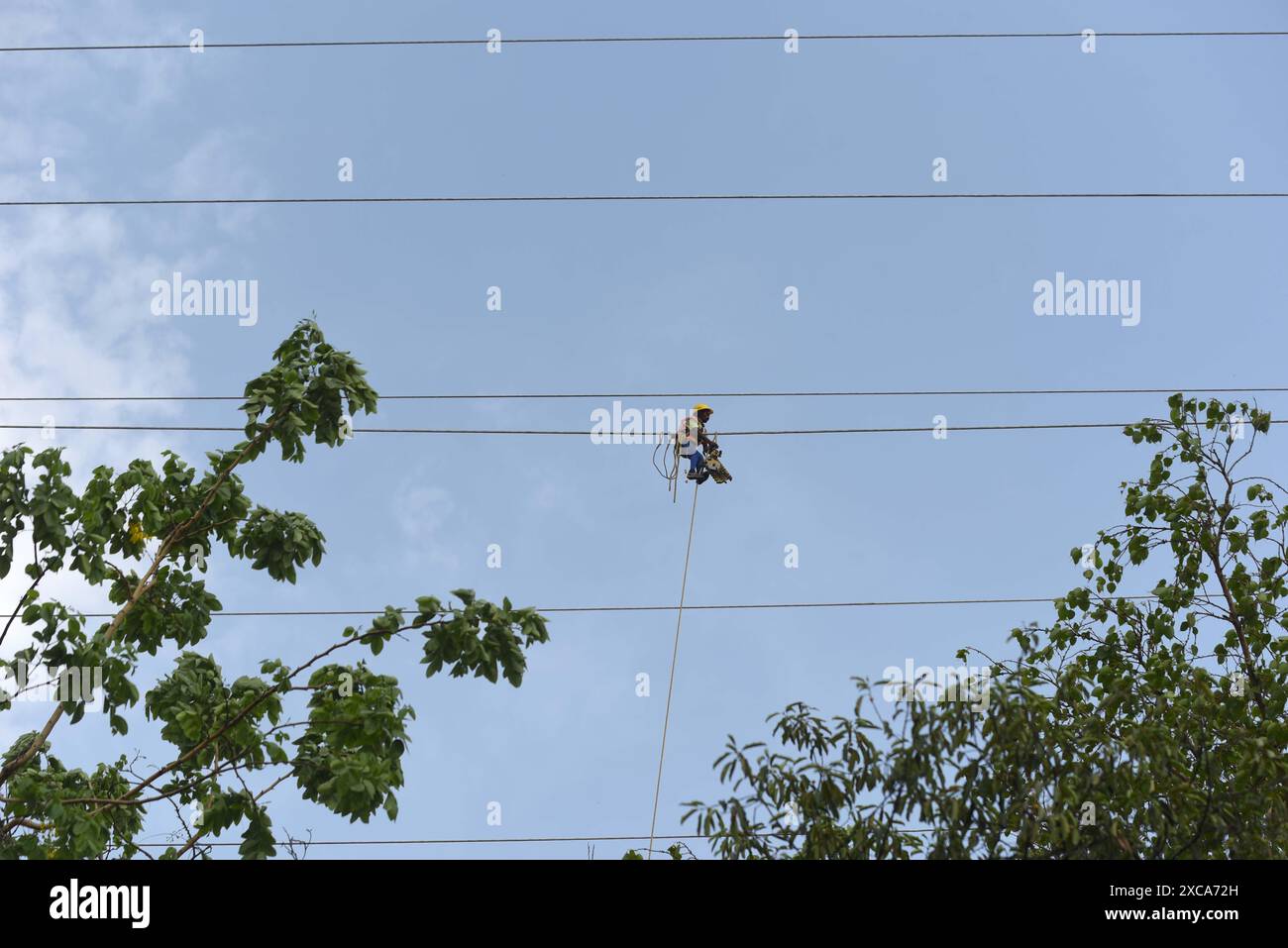 GURUGRAM, INDIA - JUNE 15: Workers are seen changing the wires on a ...