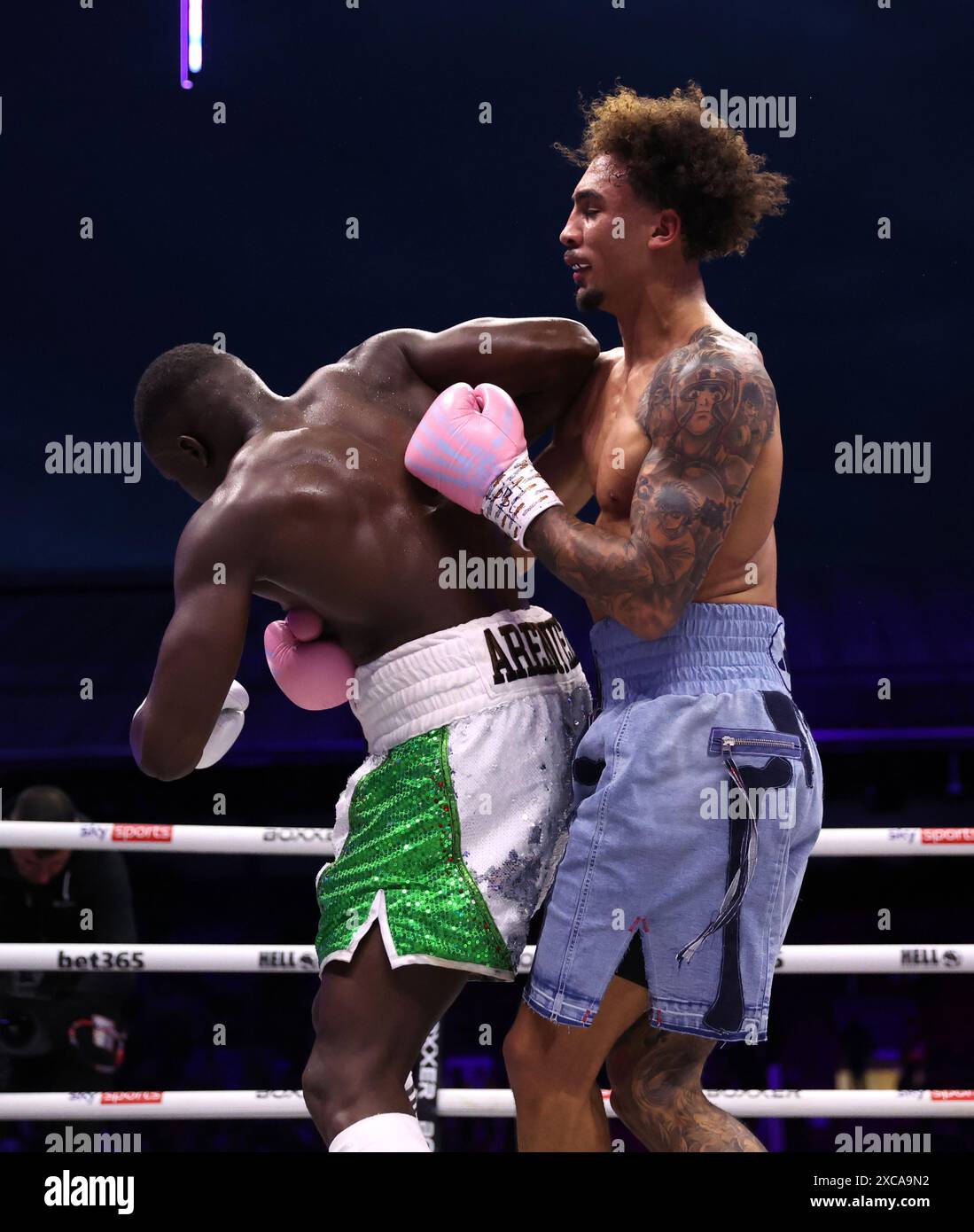 Eworitse Ezra Arenyeka (left) hits Ben Whittaker with an elbow in the ...