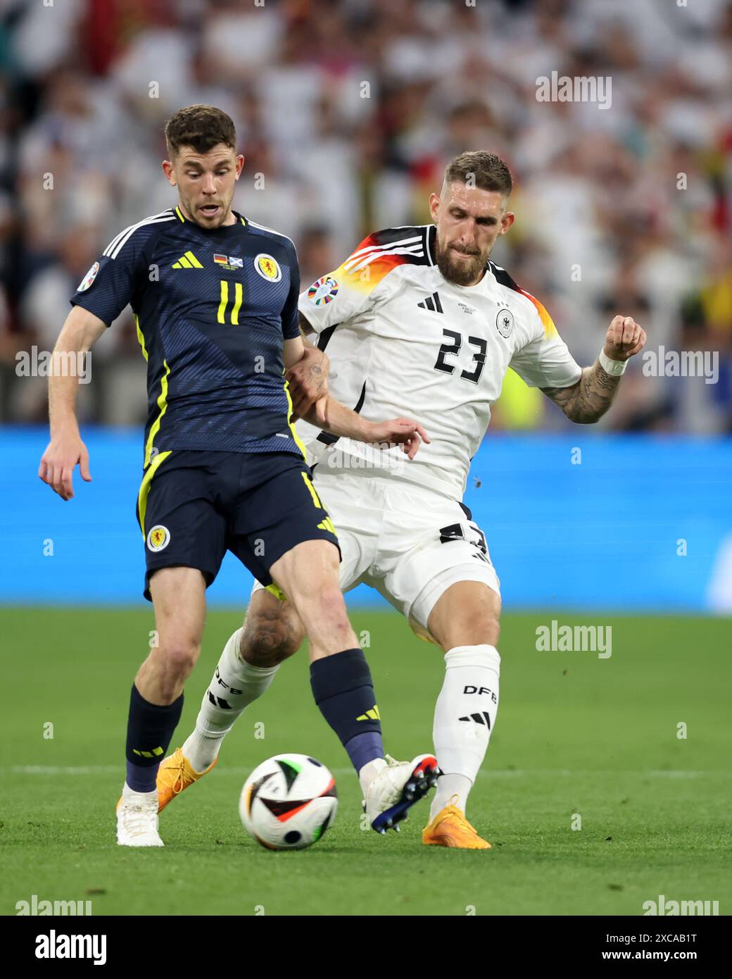 MUNICH, GERMANY - JUNE 14: Ryan Christie of Scotland vies with Robert ...