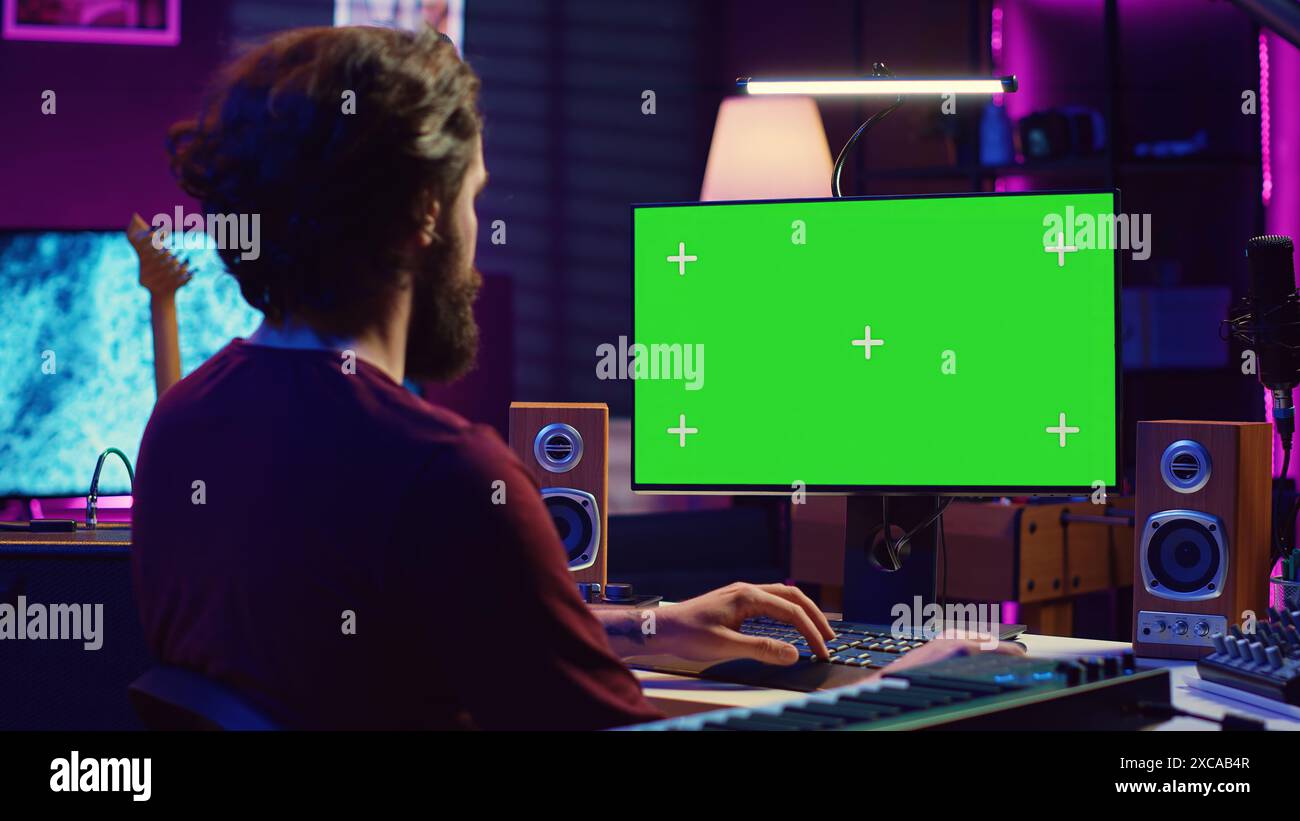 Music producer learning to use mixing console and soundboard, using ...