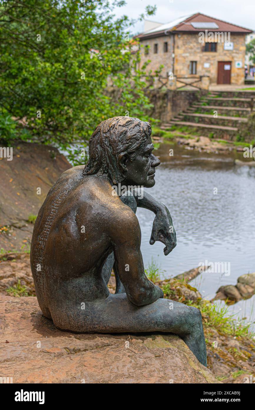 Bronze statue of the urban legend, the ‘Fish Man of Lierganes’ beside ...
