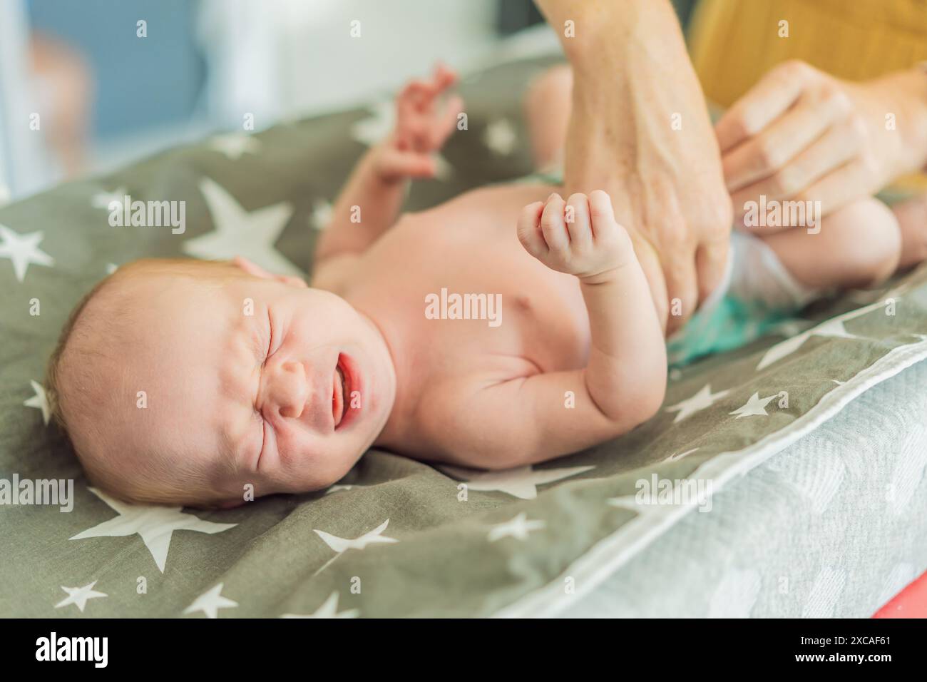 The newborn's skin is peeling. Mom uses skin products and massages to ...