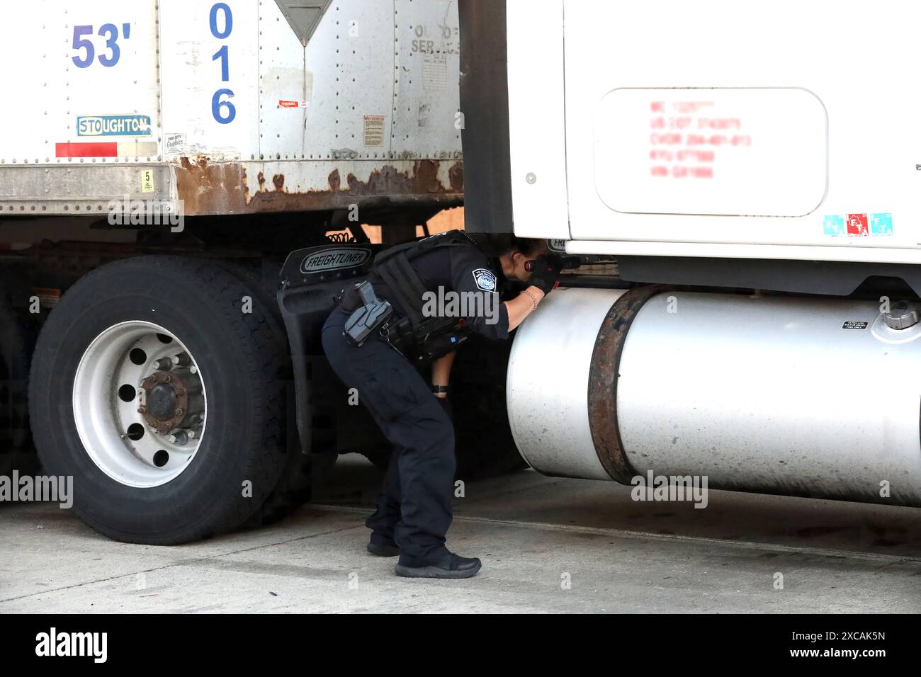 U.S. Customs and Border Protection Officers conduct outbound ...
