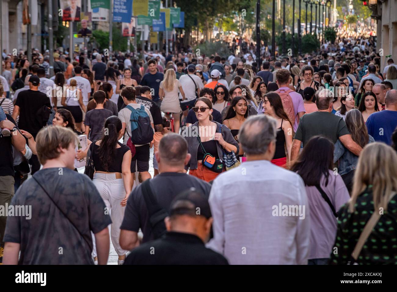 This Saturday evening people crowd Portal del Angel shopping street in ...