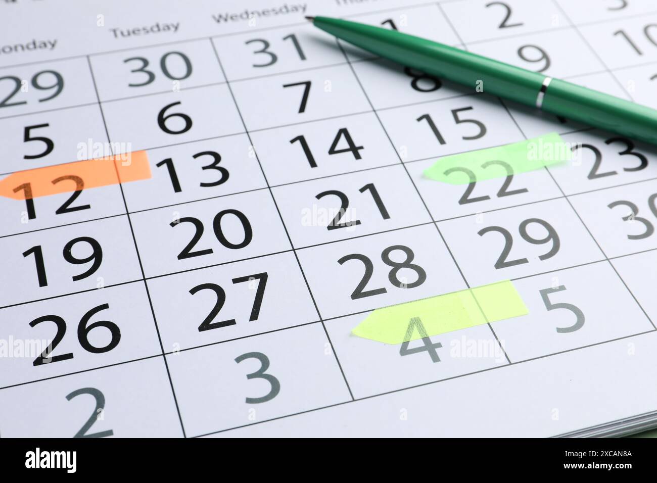 Timetable. Calendar page with marked dates and pen, closeup Stock Photo ...