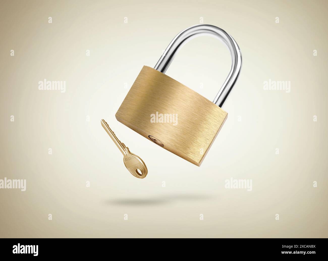 Padlock and key in air on color background Stock Photo - Alamy