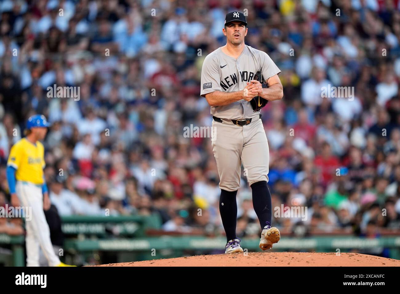 New York Yankees pitcher Carlos Rodón rubs up a ball after giving up a ...