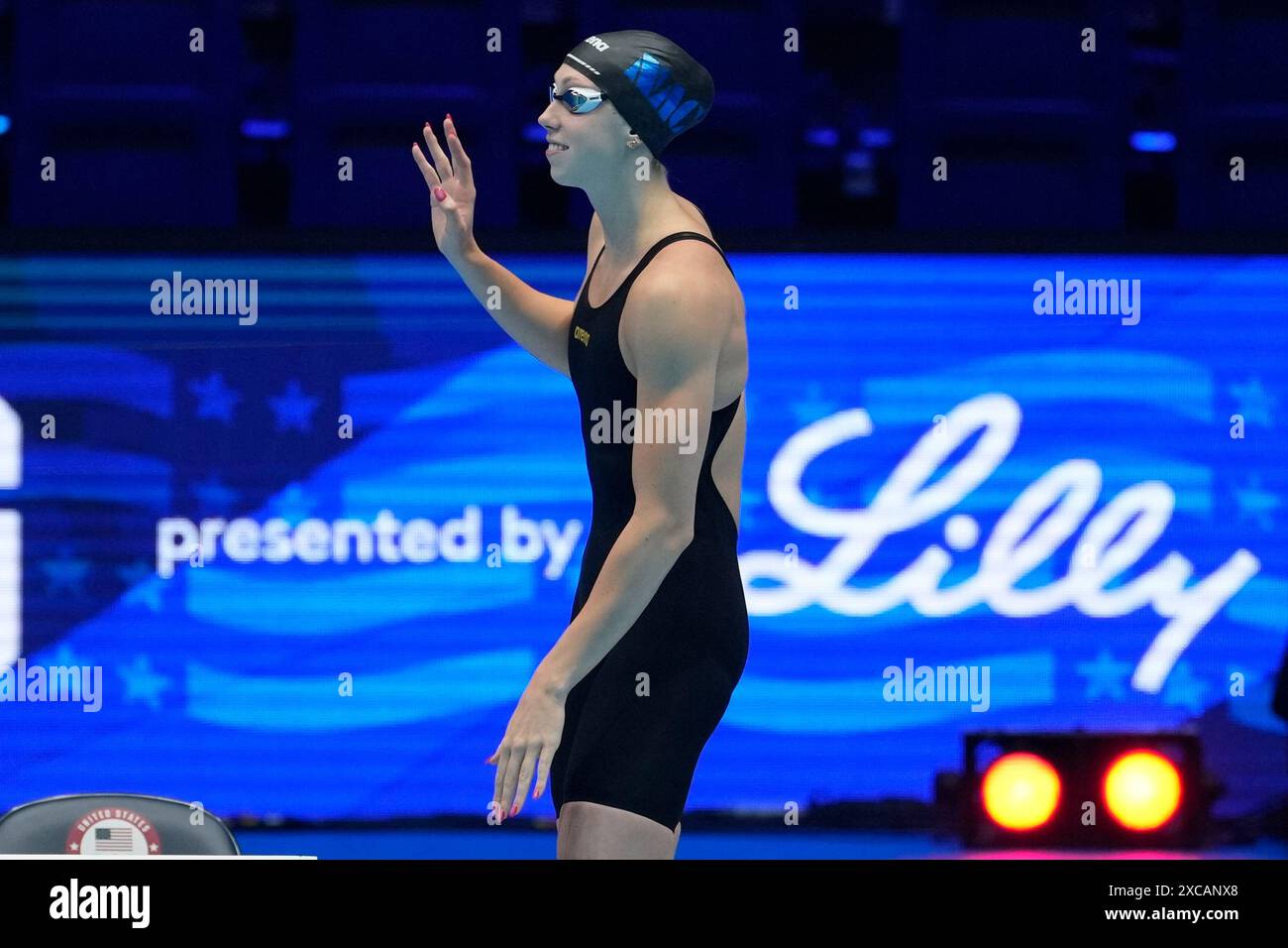 Gretchen Walsh waves before the Women's 100 butterfly semifinals heat ...