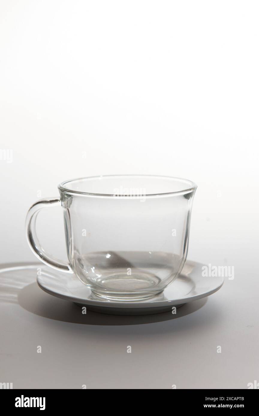 An empty, clear glass coffee cup isolated on a white background Stock ...