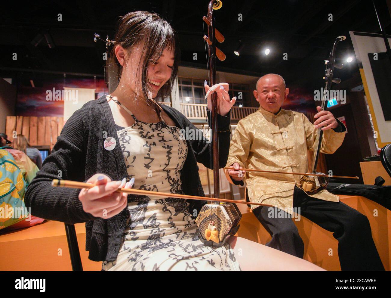 Vancouver, Canada. 15th June, 2024. A woman tries traditional Chinese ...