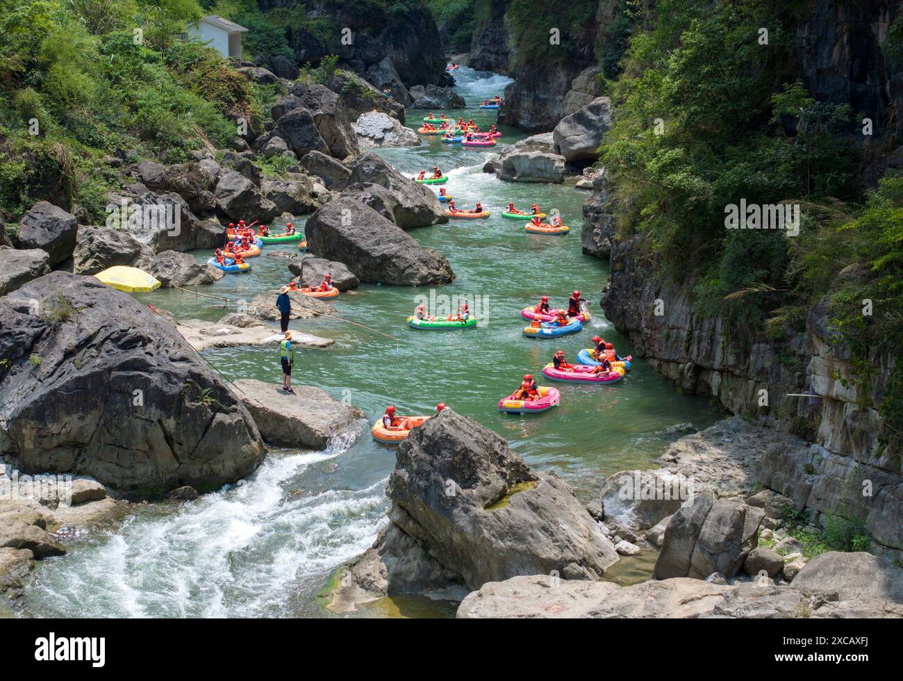 YICHANG, CHINA - JUNE 15, 2024 - Tourists experience canyon rafting ...