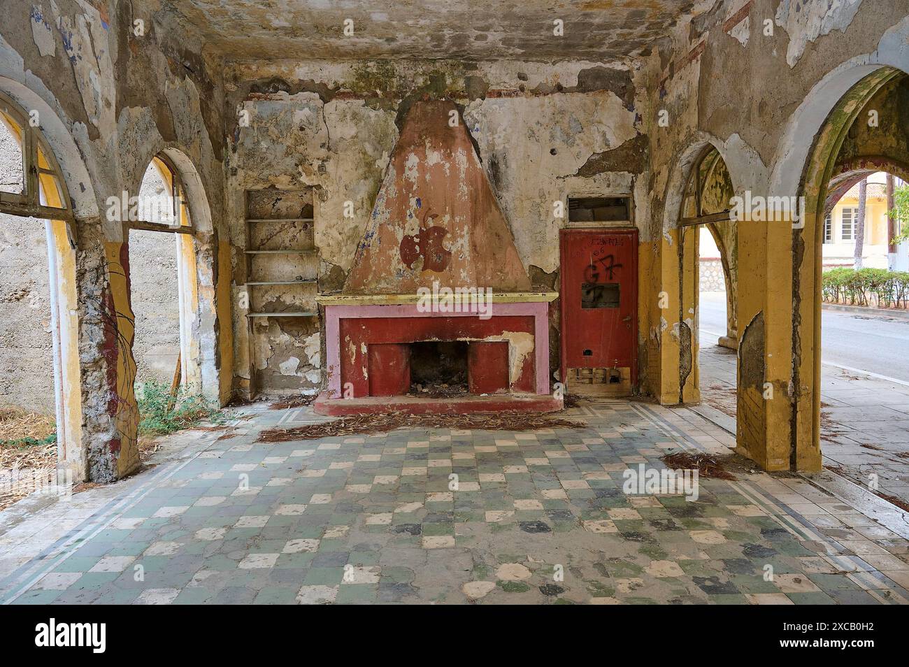 Abandoned room with ruined floor and walls, dilapidated fireplace and ...