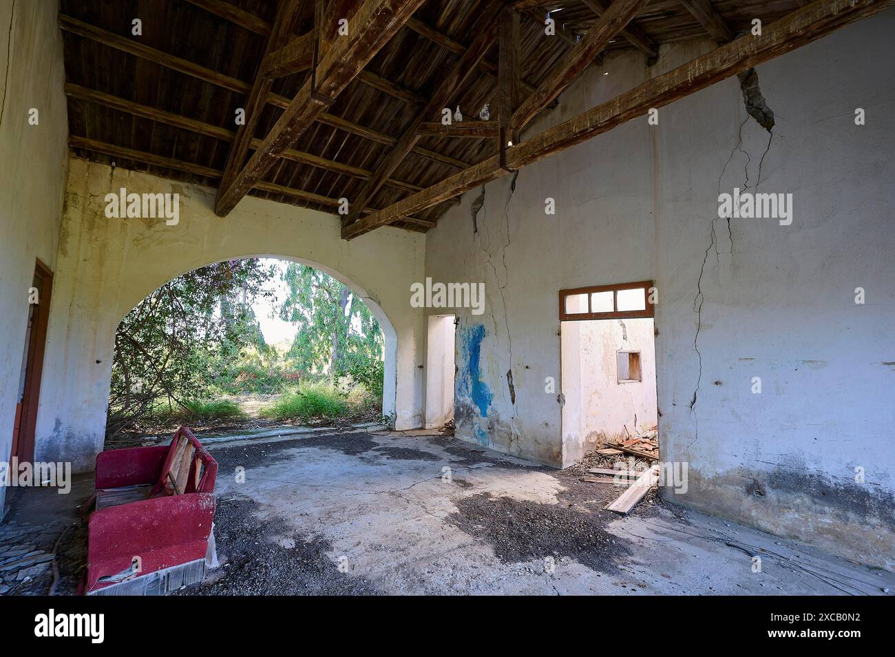 Abandoned building with cracks in the walls and a dilapidated interior ...