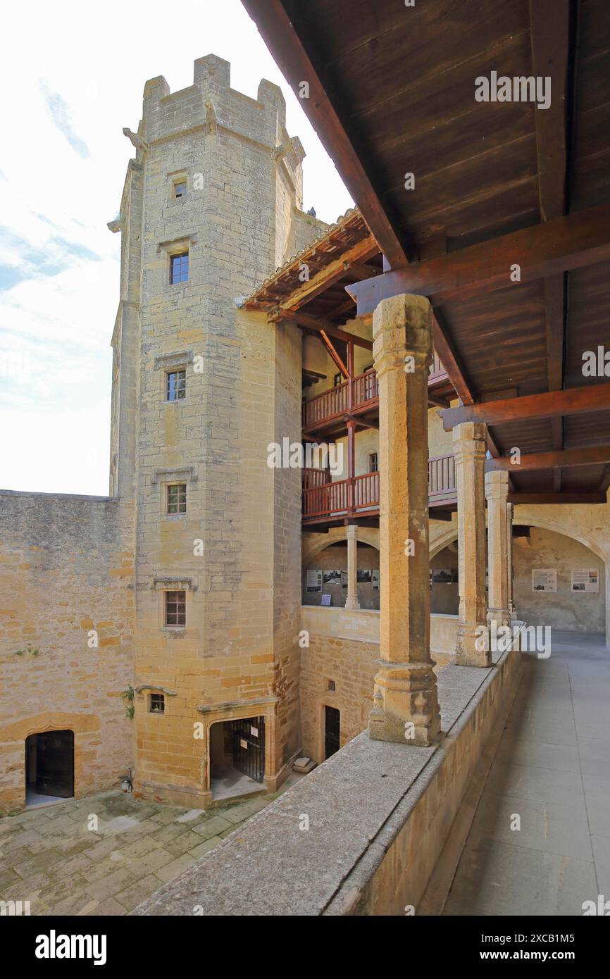 Courtyard with arcade, columns and tower of the chateau built in the ...