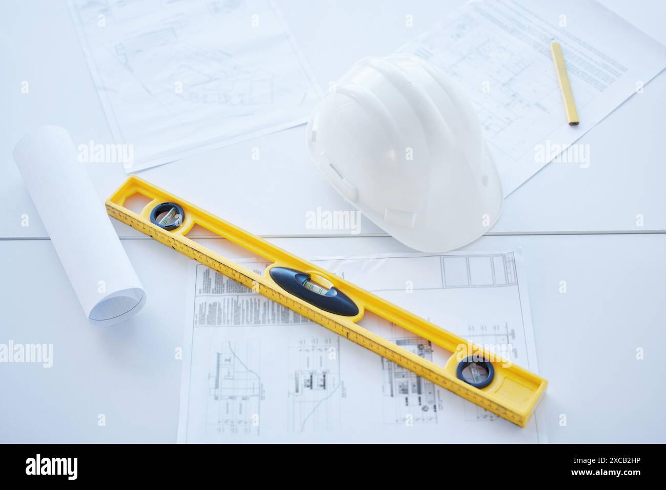 Architecture, level and above of desk with blueprint, floorplan and ...