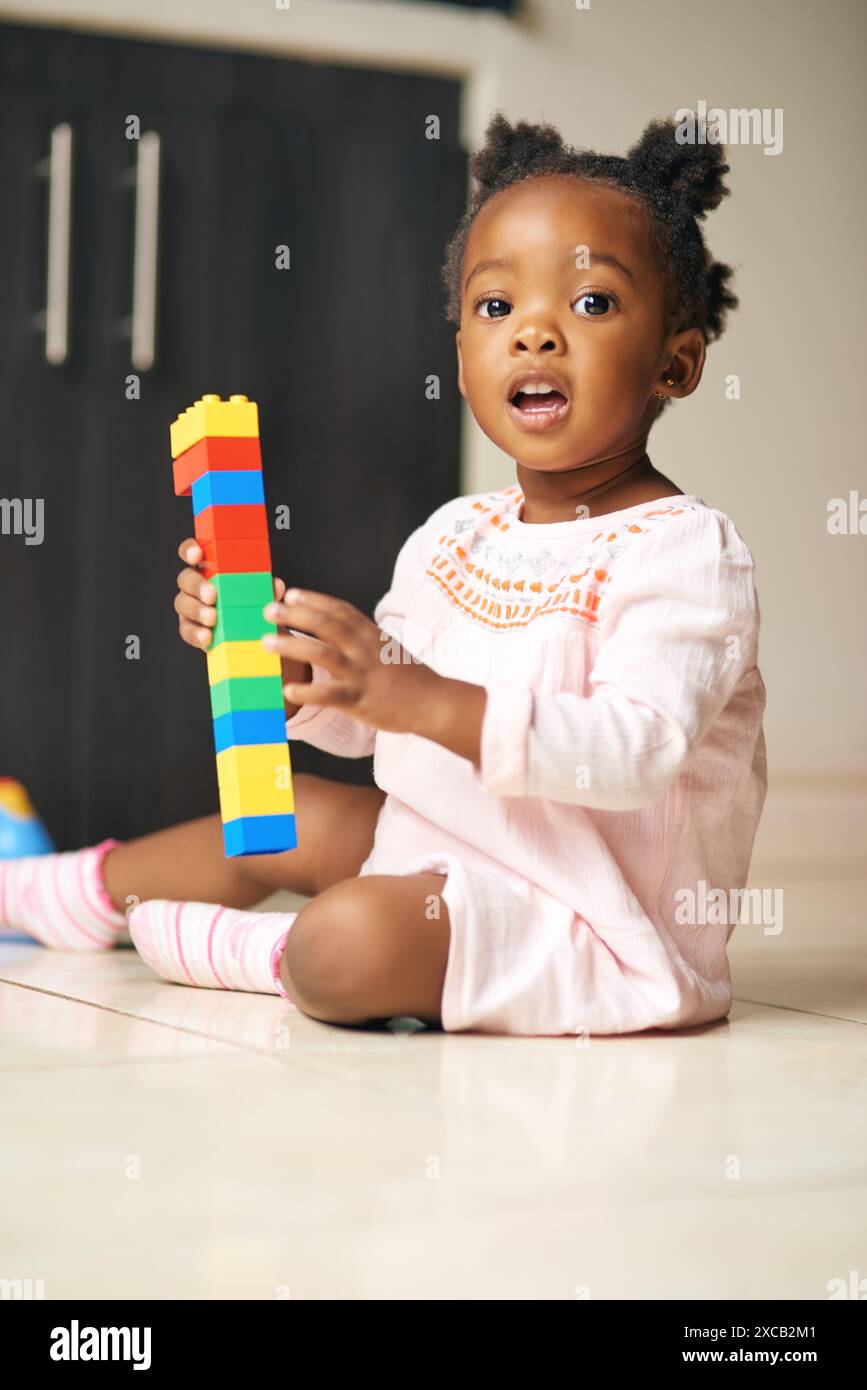 African baby playing with color blocks hi-res stock photography and ...