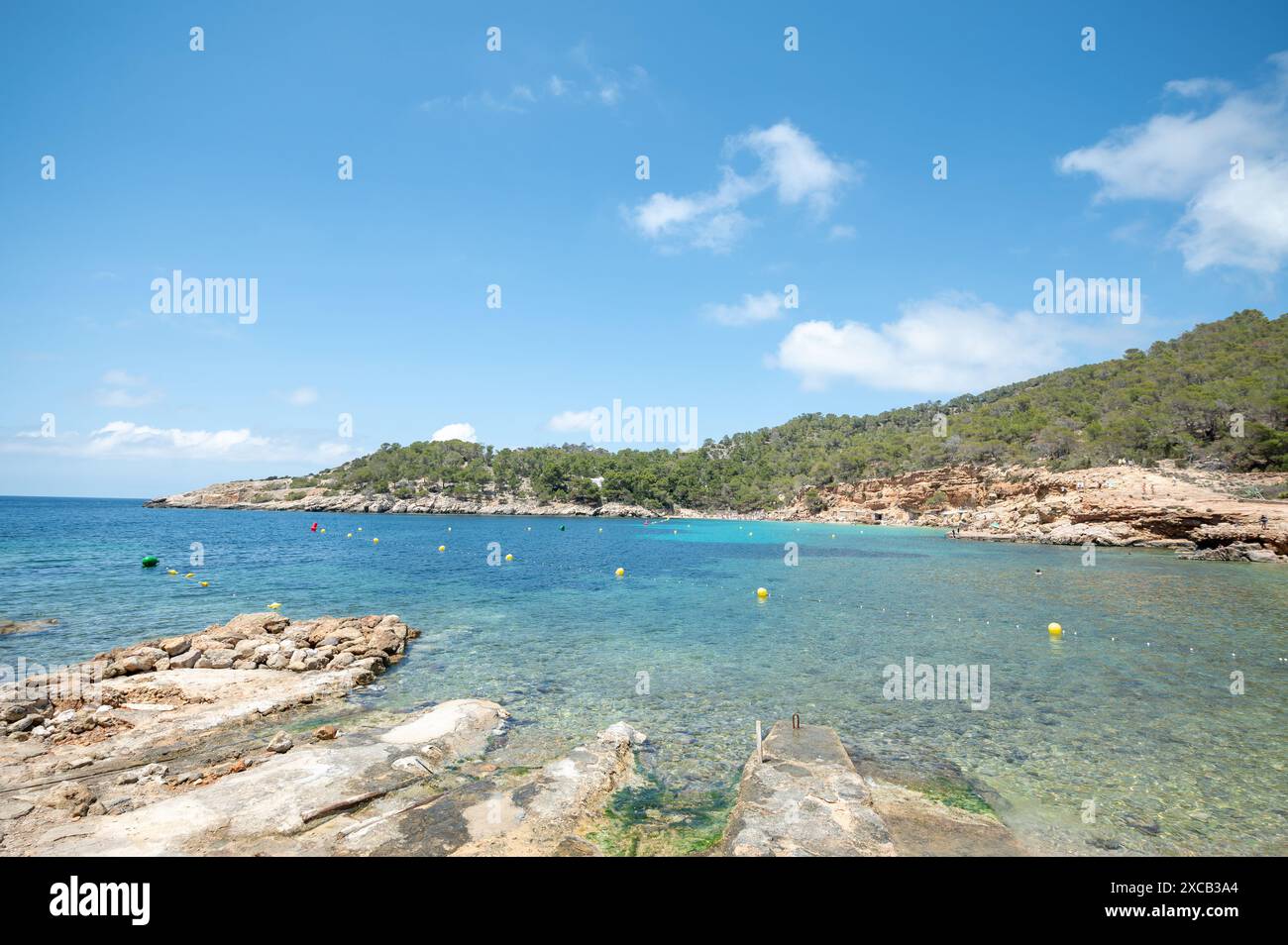 Cala Saladeta, Ibiza, Spain: 2024 May 16: People on the beach of Cala ...