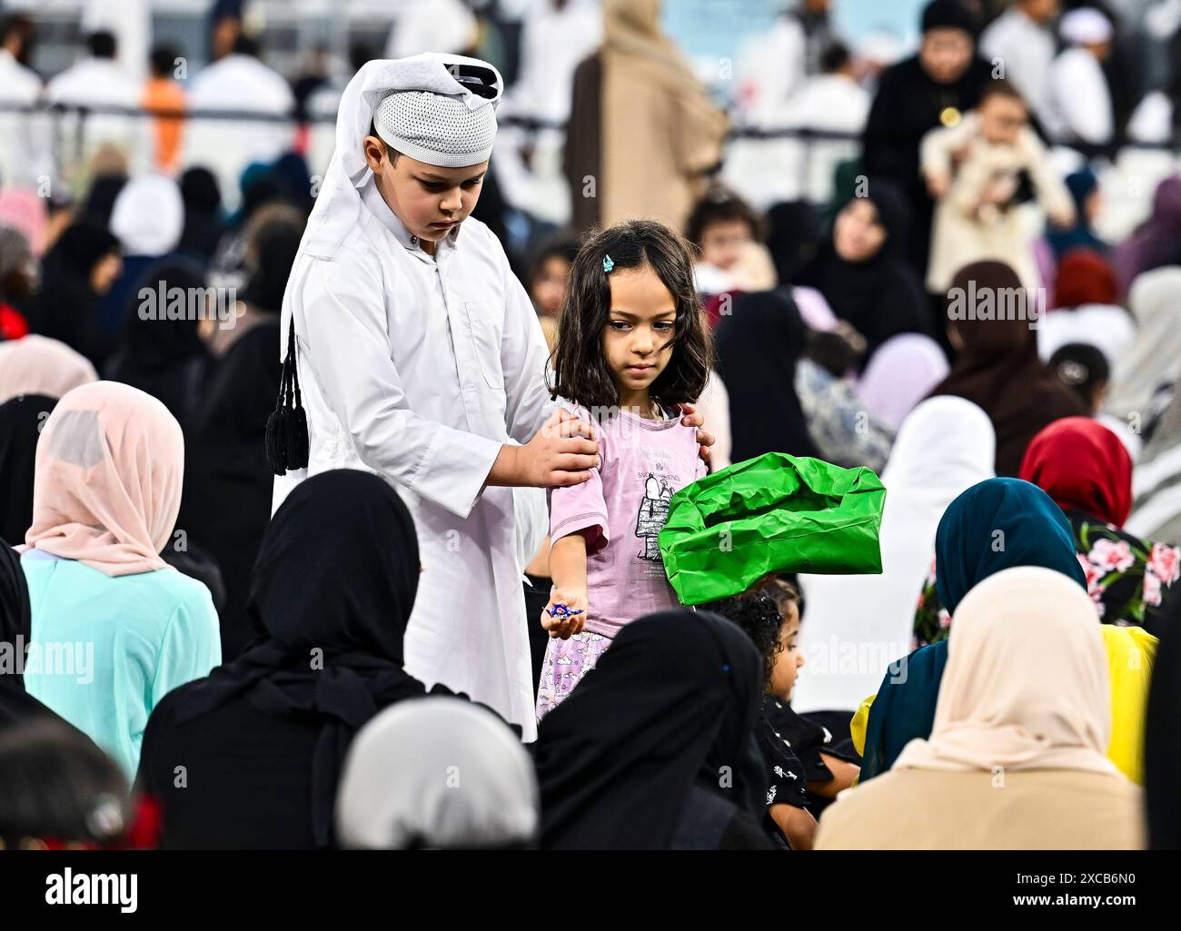 EID AL-ADHA PRAYER 2024 DOHA Children give sweets after performing the ...
