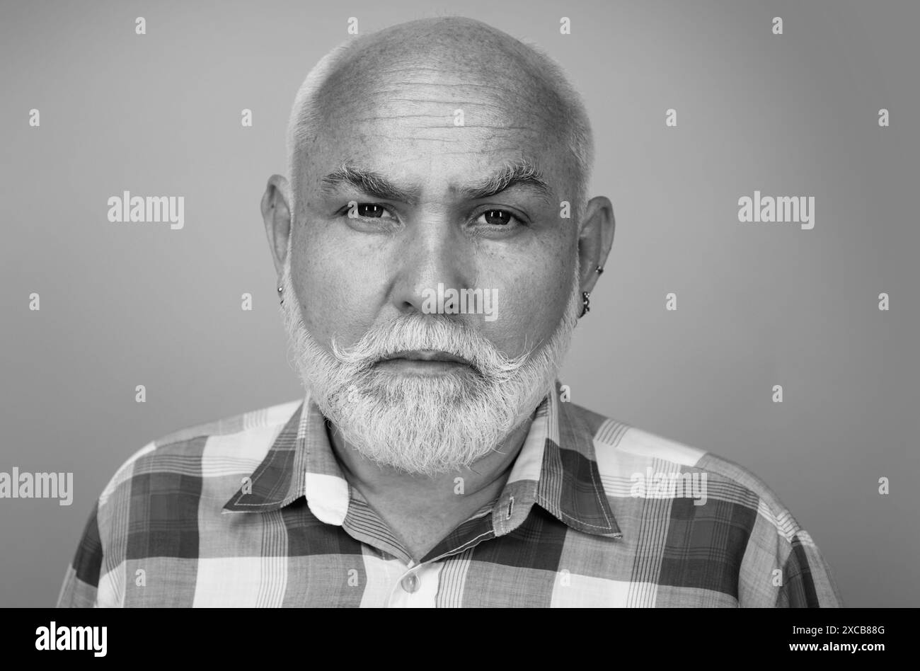 Face of 60s elderly retired mature aged pensioner. Serious old mature ...