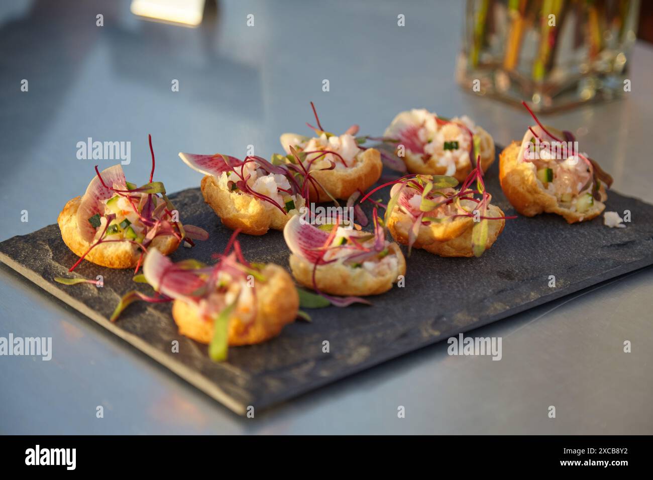 Elegant and delectable hors d'oeuvres with garnishes served on a slate ...