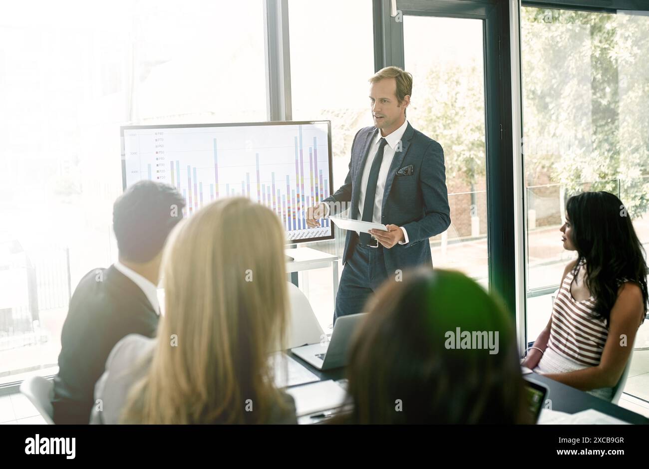 Businessman, meeting and conversation with data on screen for hr ...