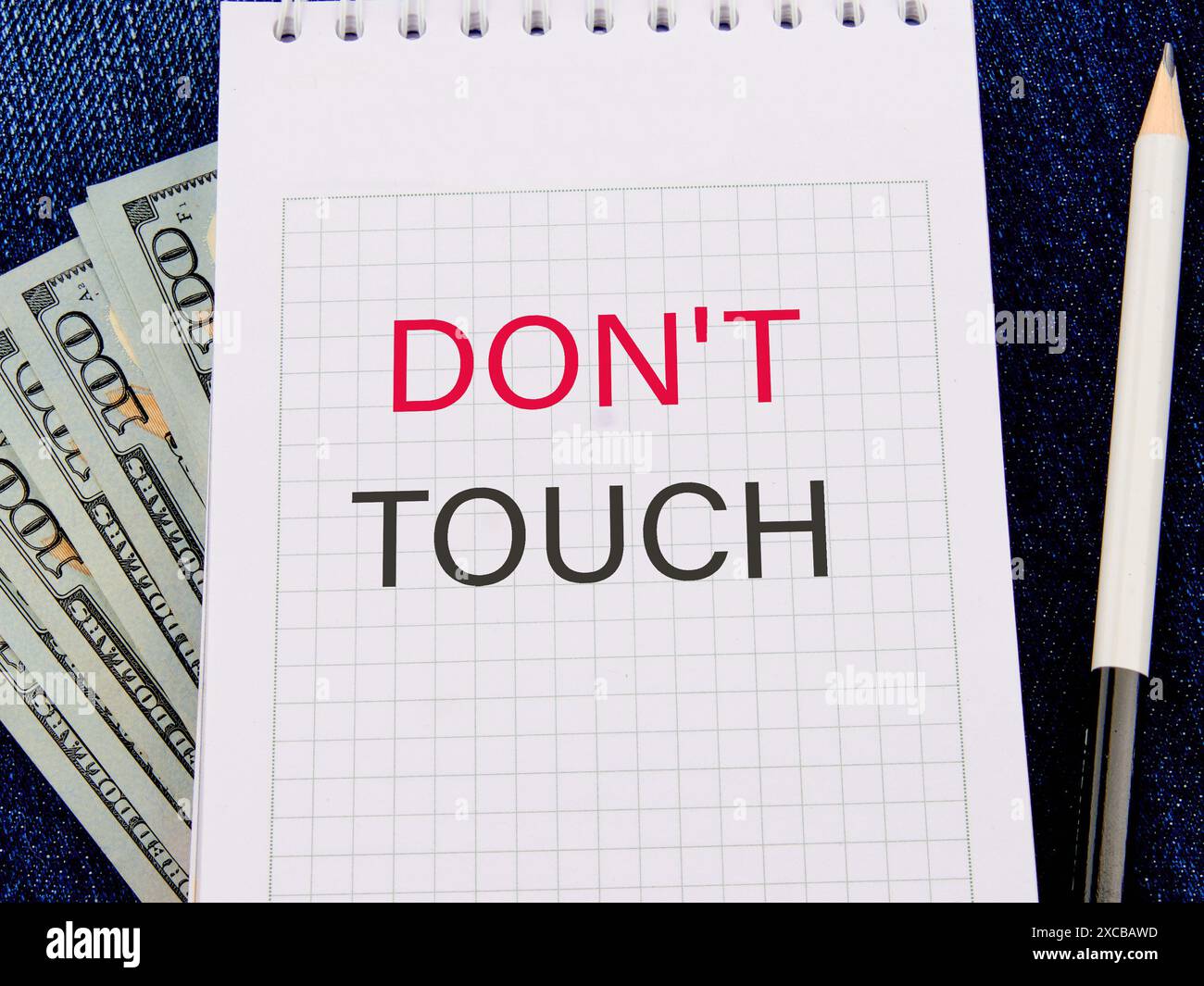 Do not Touch ME text written in a notebook in a composition with ...