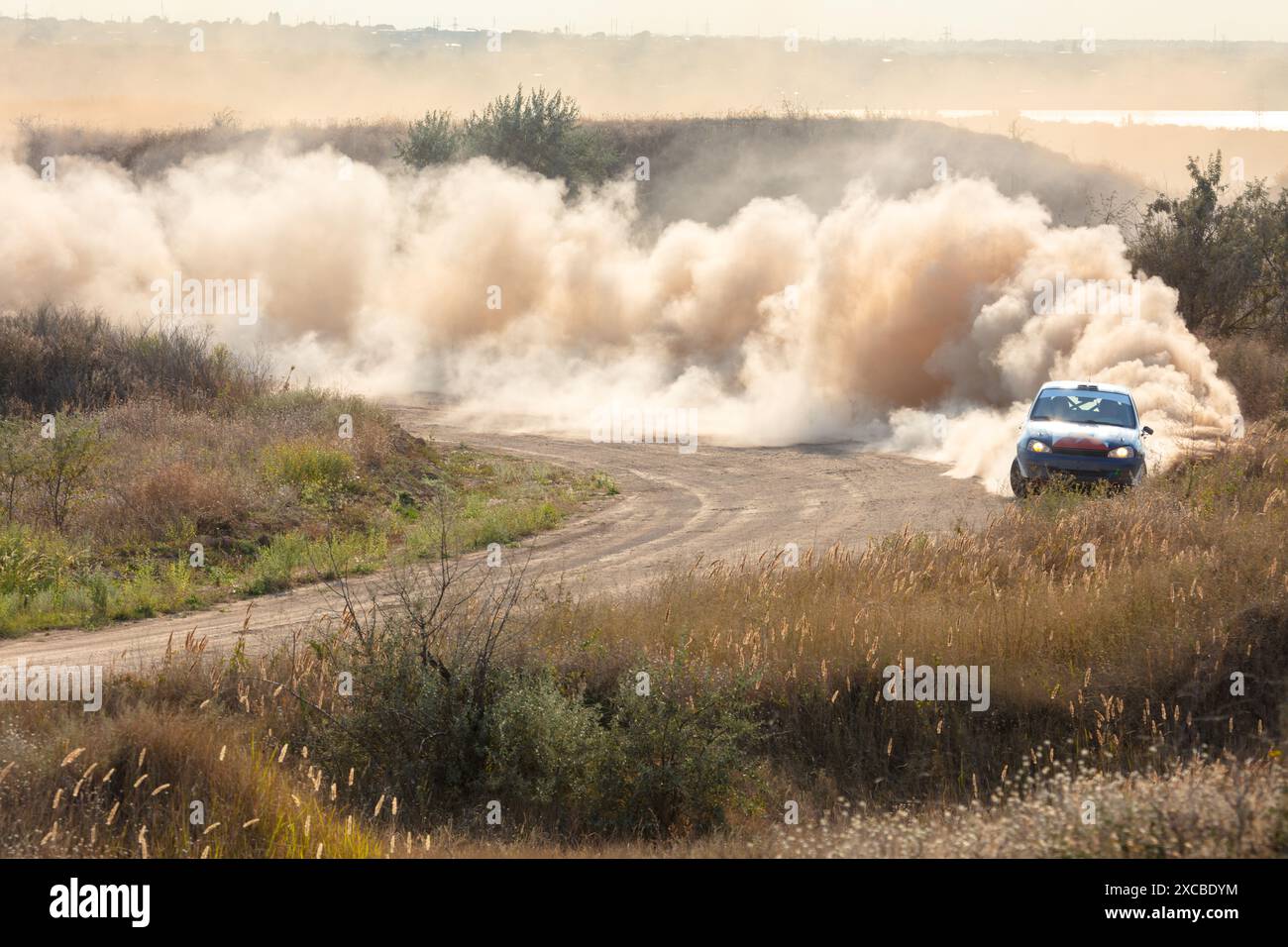 Sunny summer day. A sharp turn on a rally dirt track. The rally car ...